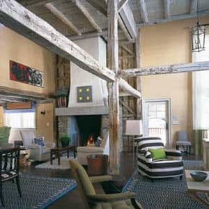 Living room area with tall ceilings and fireplace.