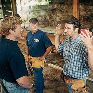 This Old House cast members having a conversation on a worksite.