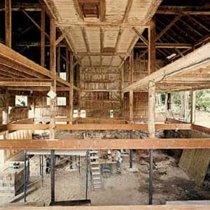 Barn interior with exposed beams.